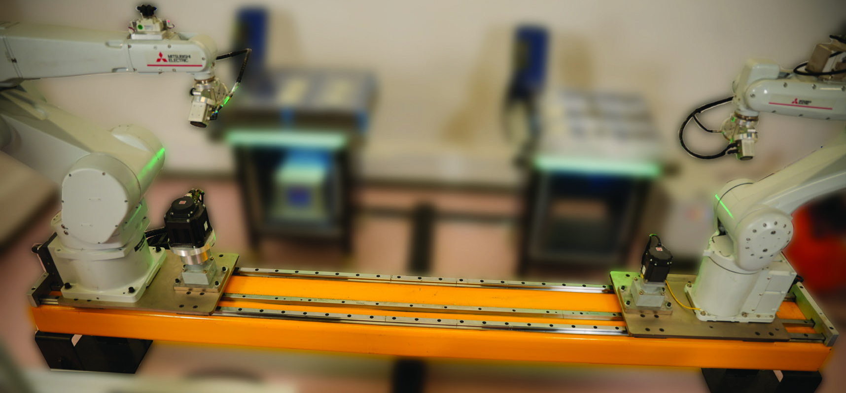 Integrated Deburring, Polishing And Engraving Cell With Dual Robots